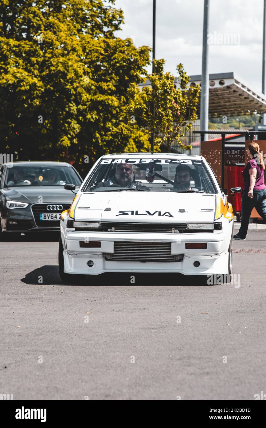 A vertical shot of a rally car head on with yellow detailing Stock ...