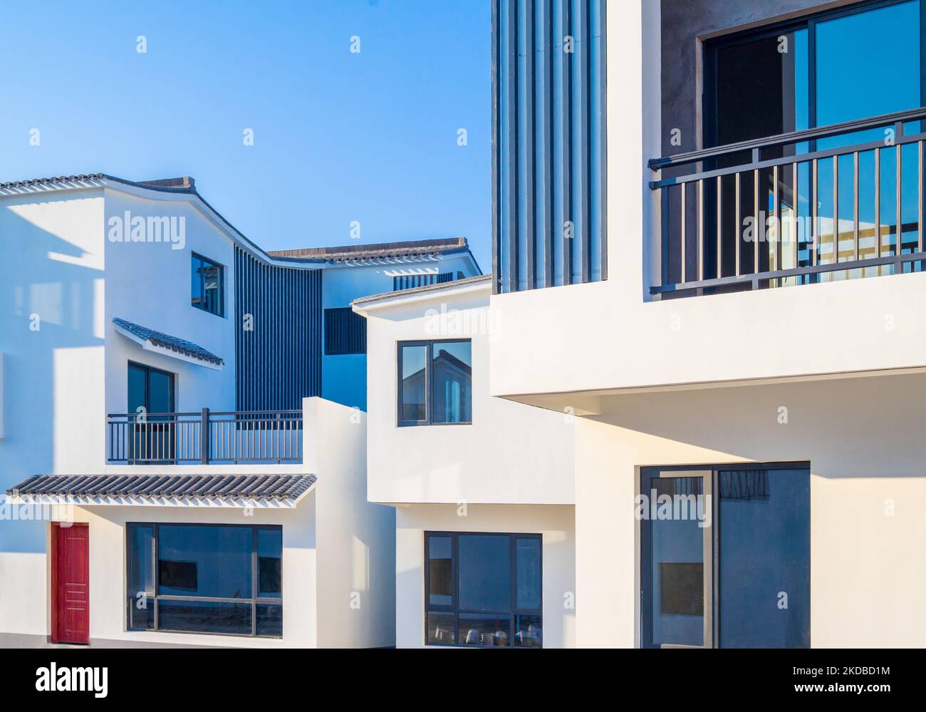 An exterior of white residential houses Stock Photo - Alamy
