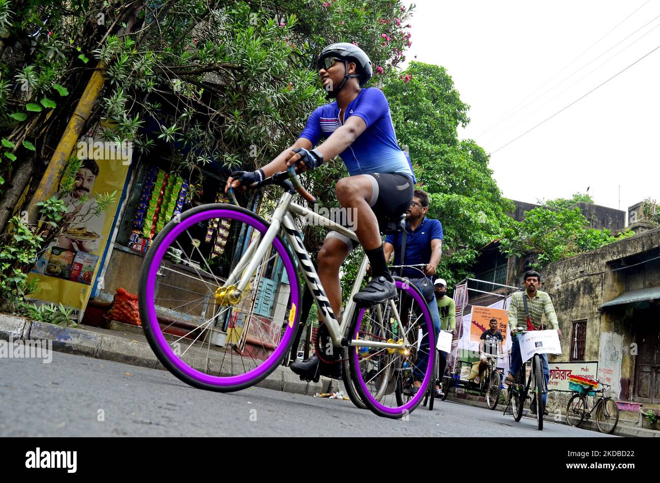 A man rides his bicycle as he participates in a bicycle rally to ...