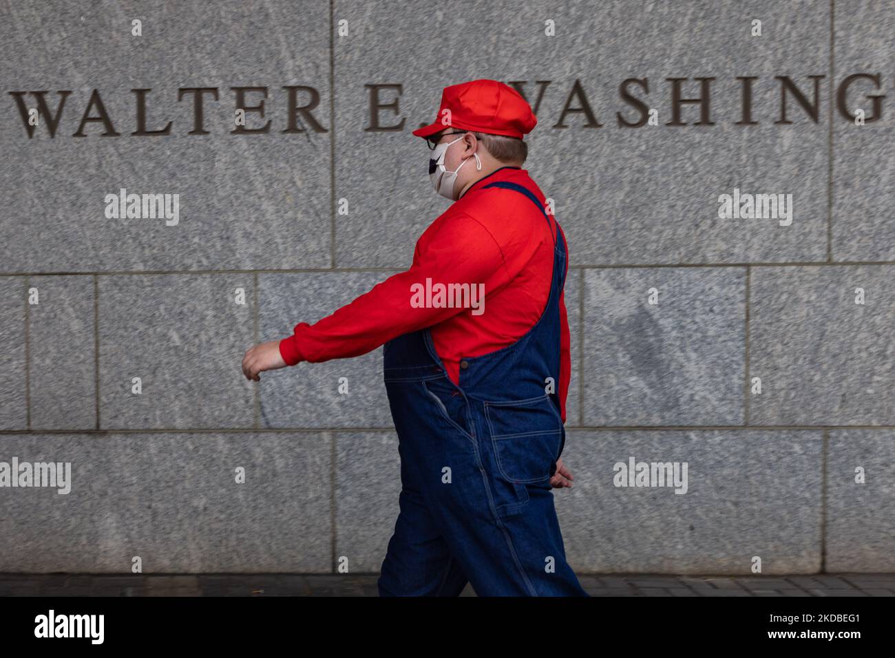 A person dressed in costume as Mario attends the 2022 Awesome Con comic ...