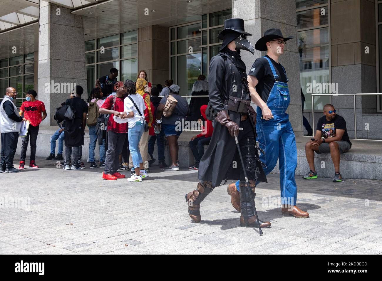 People in costume attend the 2022 Awesome Con comic convention at the ...