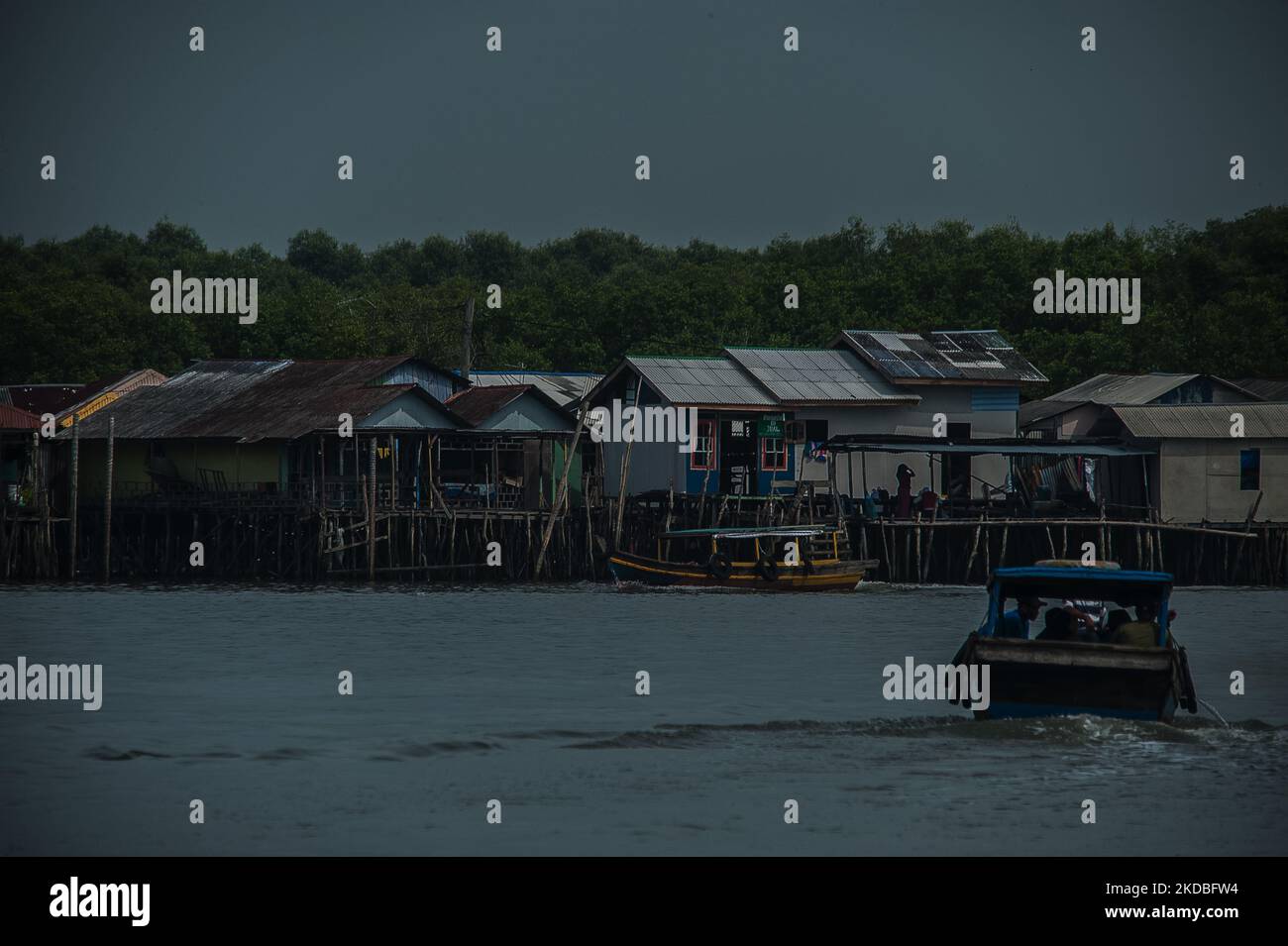 The coastal community activities are seen in the Belawan marine area in ...