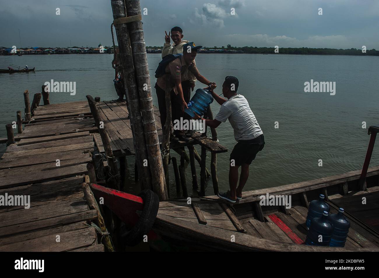 The coastal community activities are seen in the Belawan marine area in ...