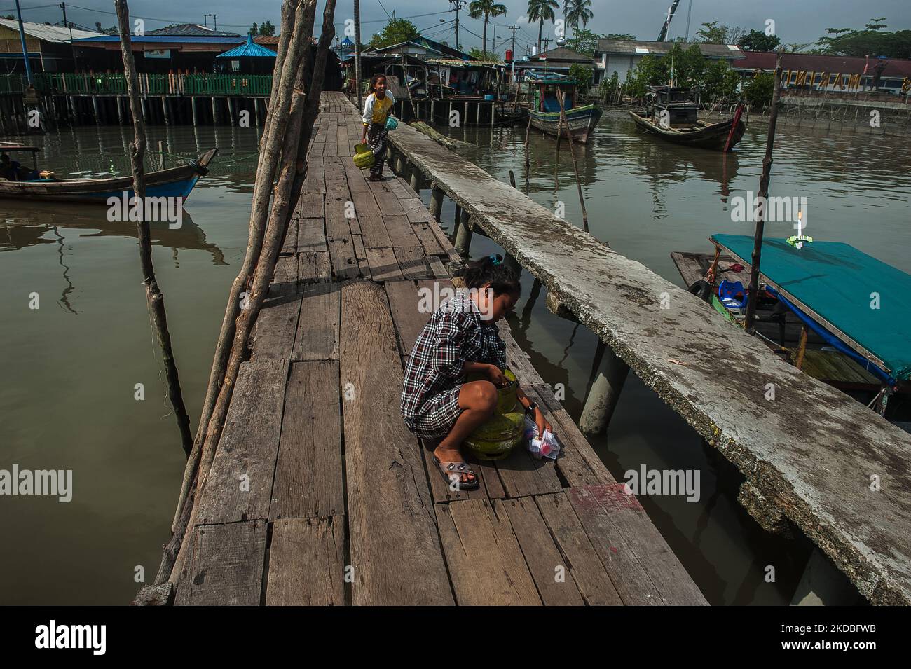 The coastal community activities are seen in the Belawan marine area in ...