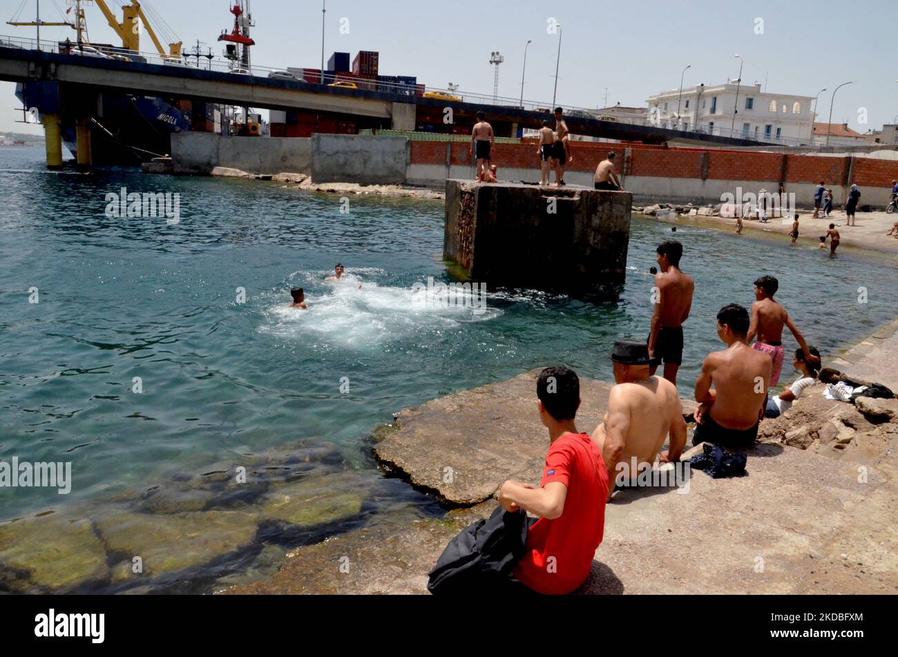 A group of young people enjoying the sea in very hot weather in the ...