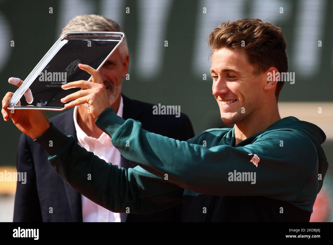 Norway's Casper Ruud holds the second place trophy following his match ...
