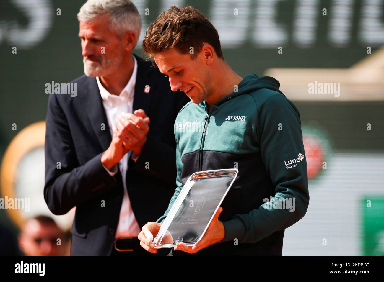 Norway's Casper Ruud holds the second place trophy following his match ...