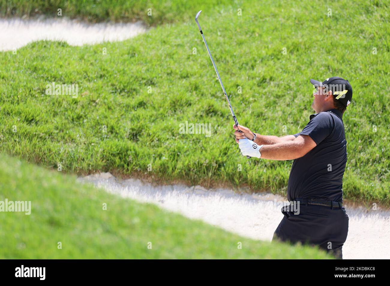 Patrick Reed of the United States hits from the bunker onto the 17th ...
