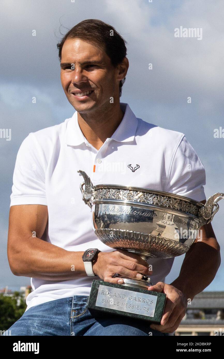 Rafael Nadal of Spain poses with his trophy on the Alexandre III bridge ...
