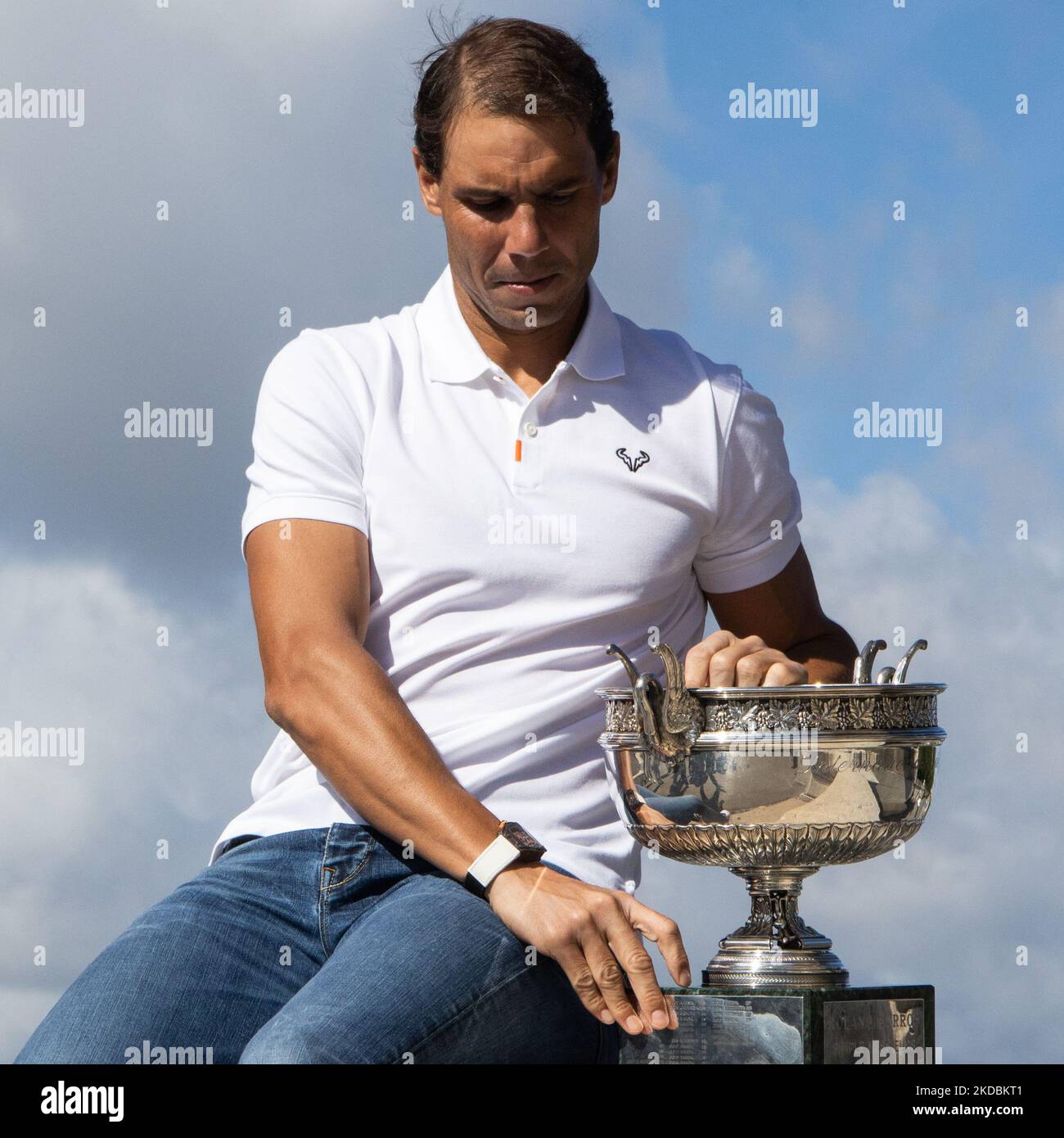 Rafael Nadal of Spain poses with his trophy on the Alexandre III bridge ...