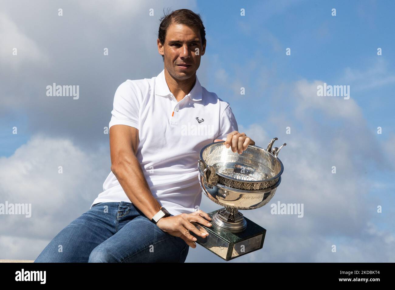 Rafael Nadal of Spain poses with his trophy on the Alexandre III bridge ...