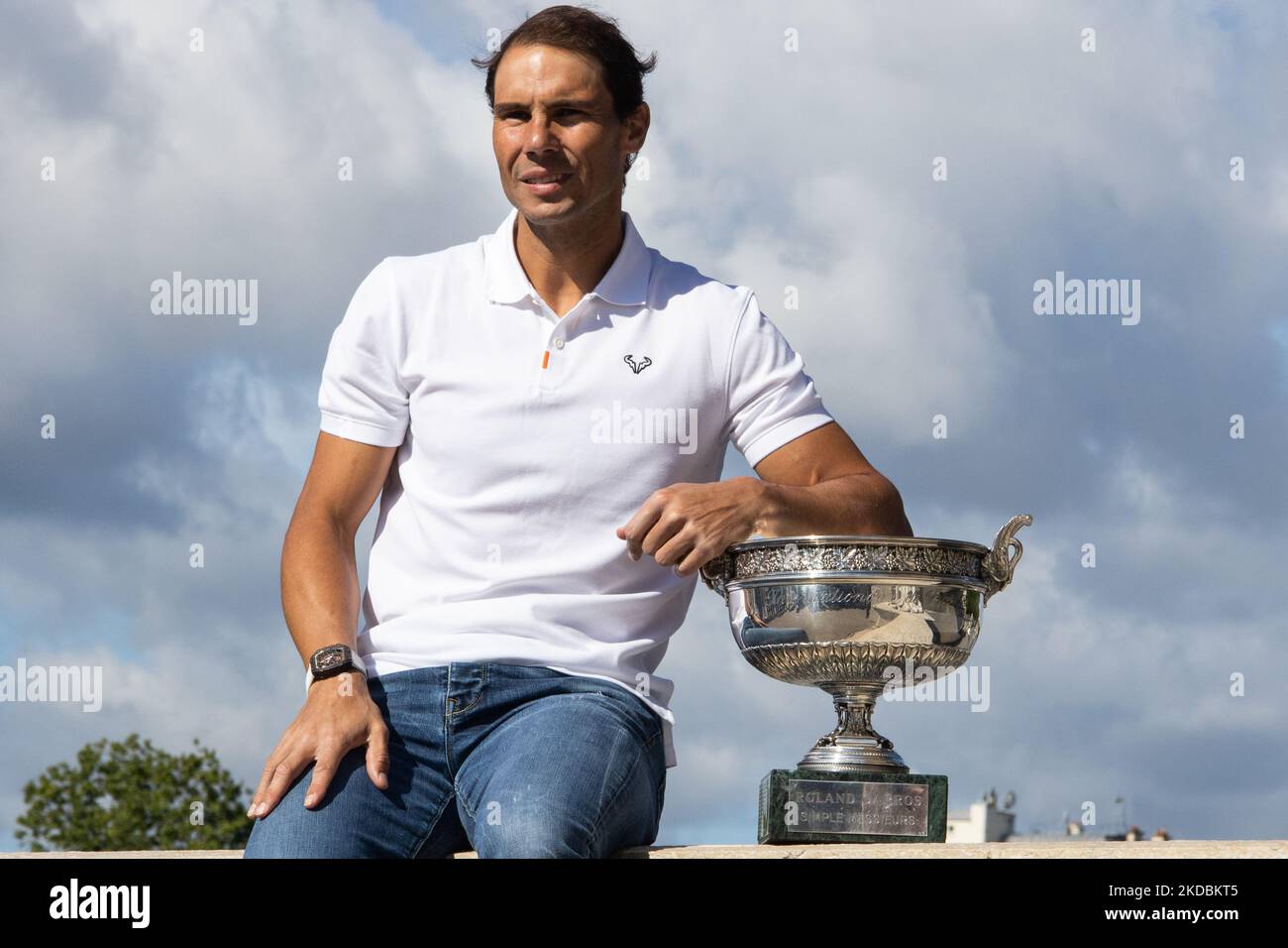 Rafael Nadal of Spain poses with his trophy on the Alexandre III bridge ...