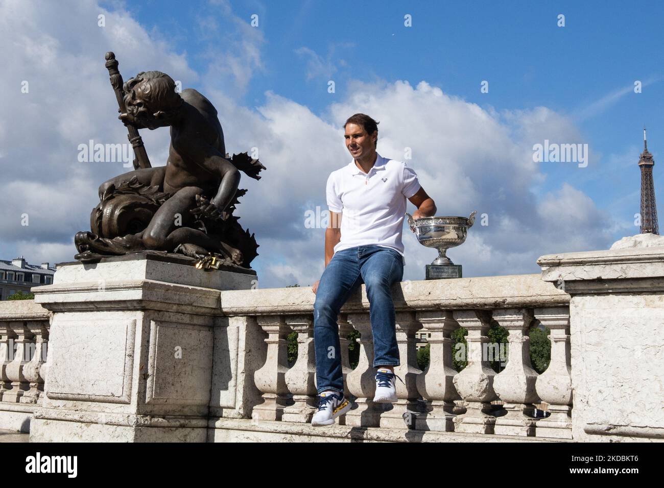 Rafael Nadal of Spain poses with his trophy on the Alexandre III bridge ...