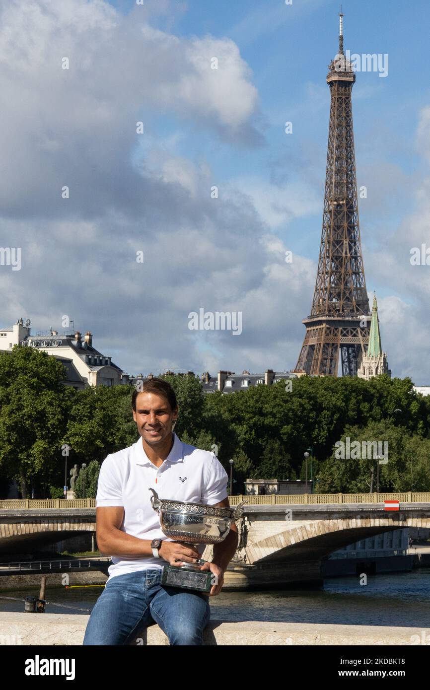 Rafael Nadal of Spain poses with his trophy on the Alexandre III bridge ...