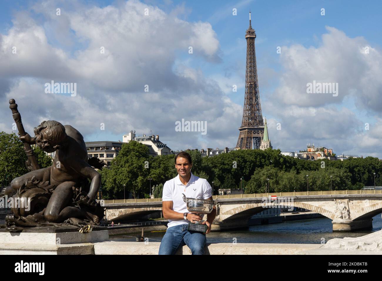 Rafael Nadal of Spain poses with his trophy on the Alexandre III bridge ...
