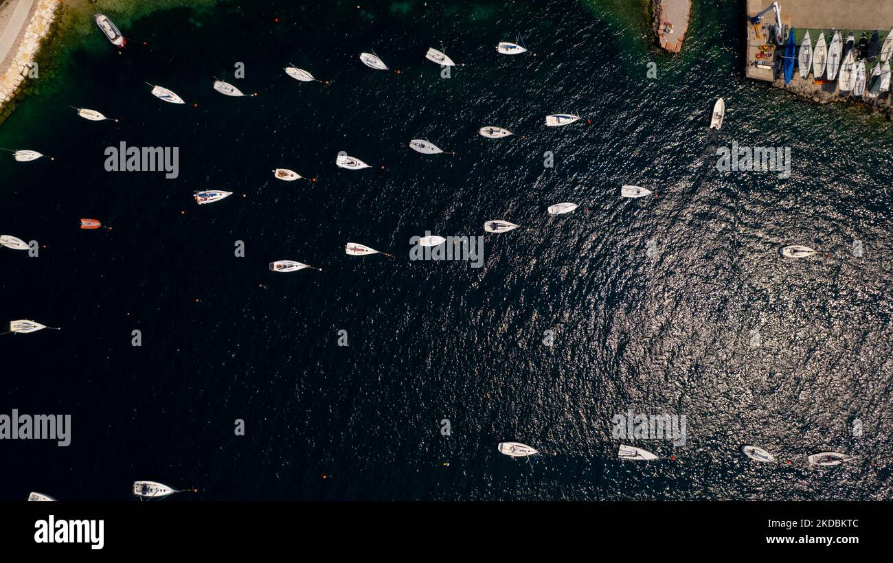 A drone view of boats in Assenza, Brenzone sul Garda at Lake Garda. The ...