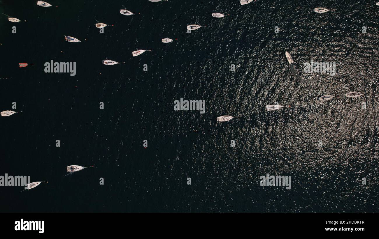 A drone view of boats in Assenza, Brenzone sul Garda at Lake Garda. The ...
