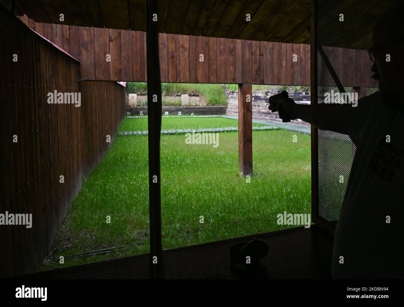 A man practicing shooting from a pistol at the Krzysztof Solarski LOK ...
