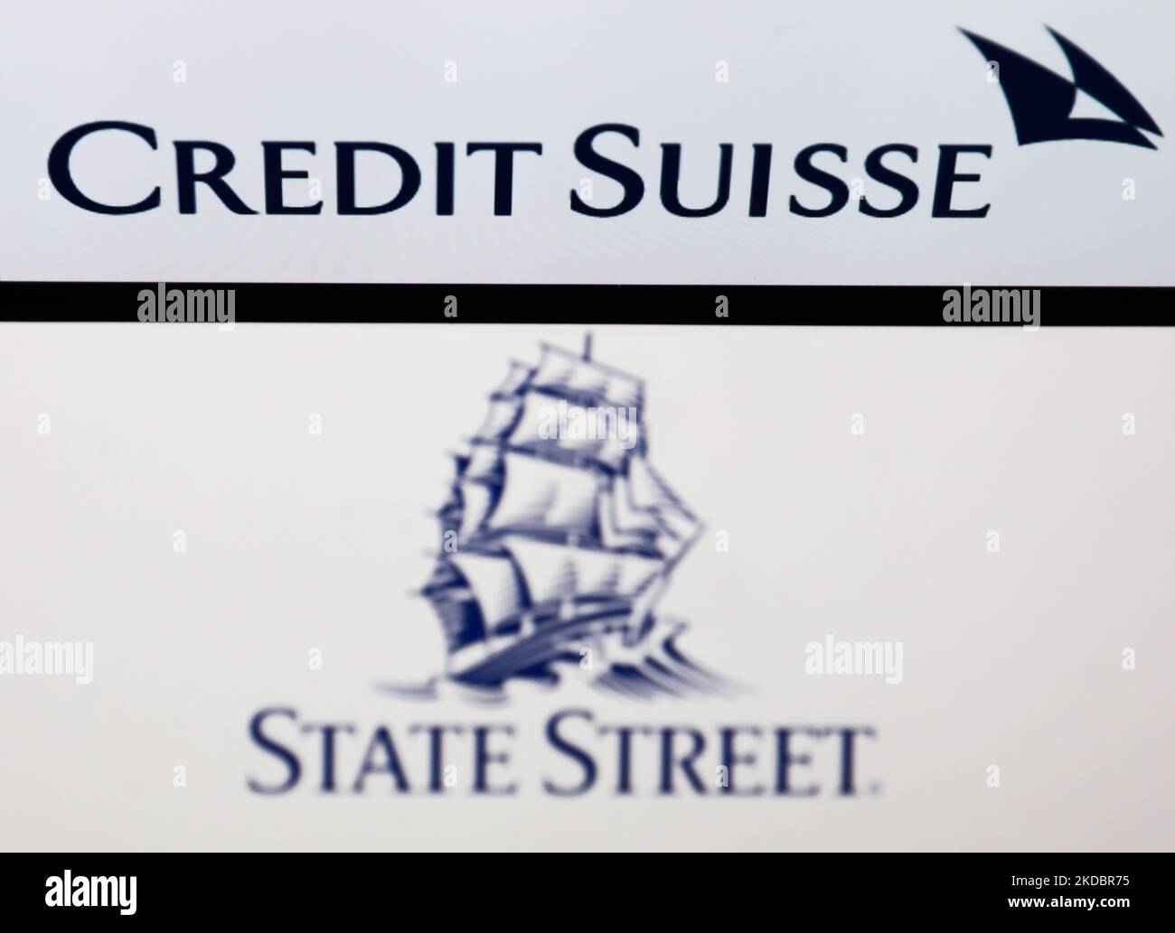 Credit Suisse logo displayed on a phone screen and State Street logo ...
