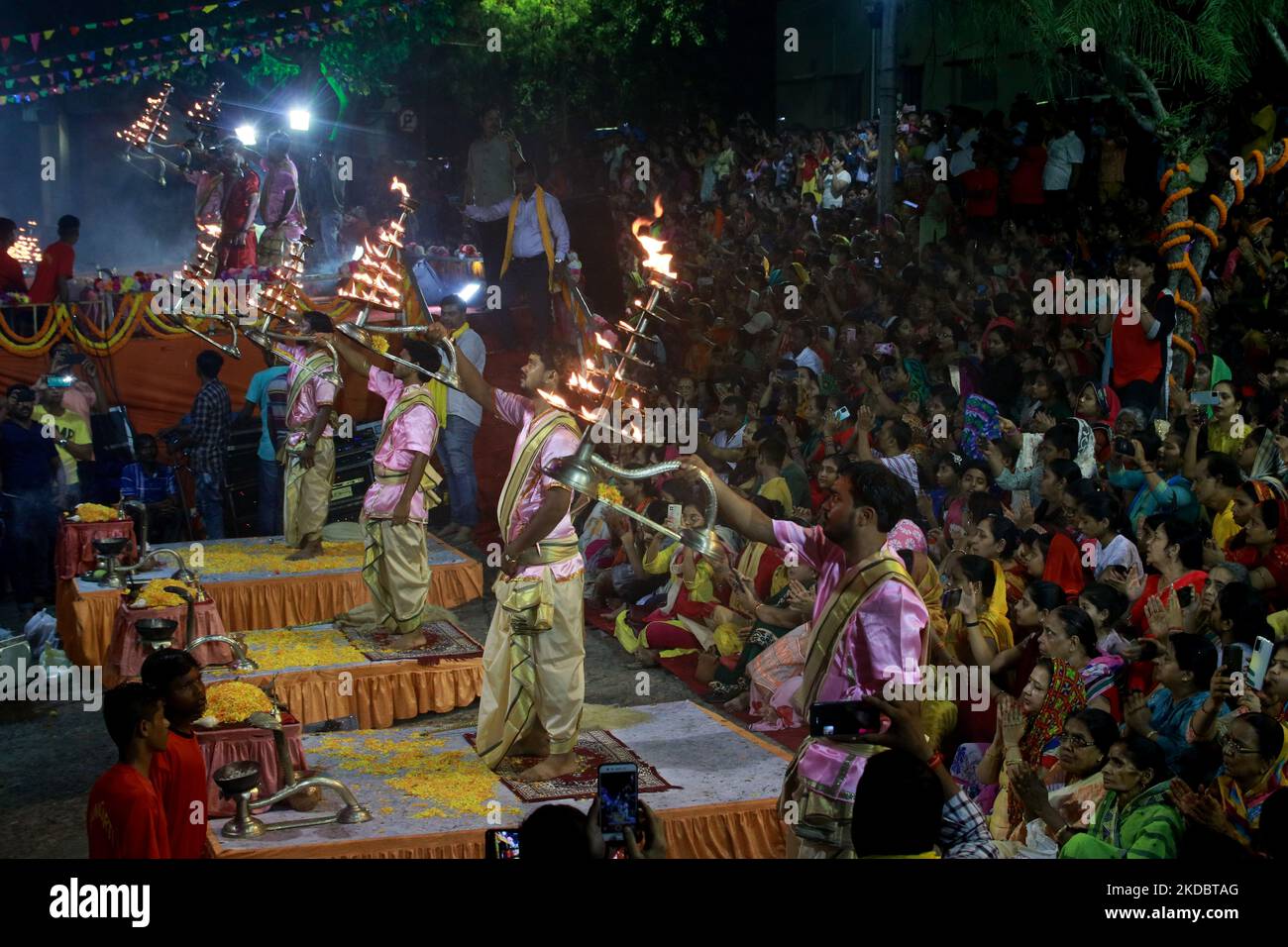 Hindu priests perform 'Ganga Aarti' prayer during a religious ceremony ...