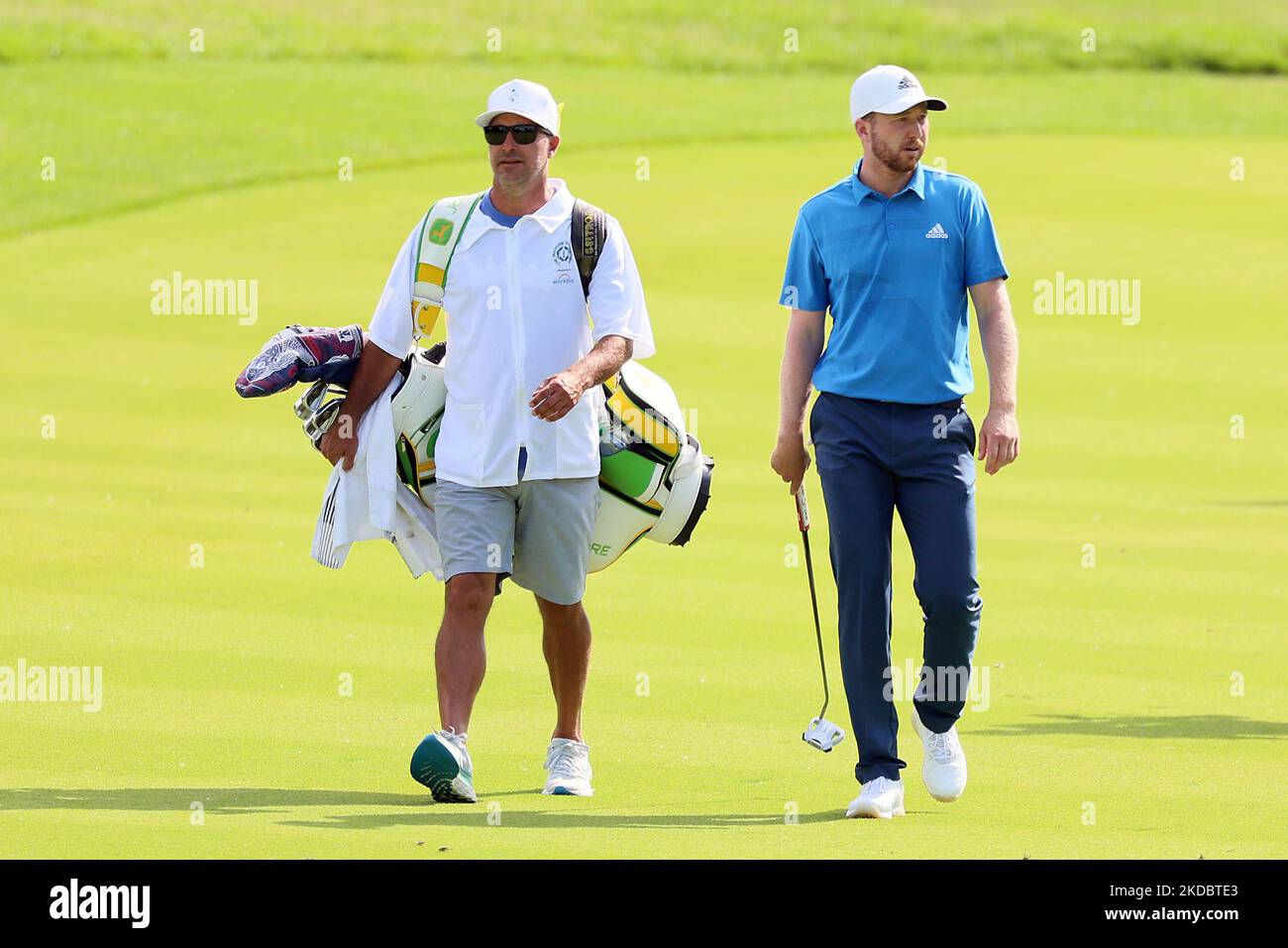 Daniel Berger of Jupiter, Florida walks with his caddie to the 17th ...