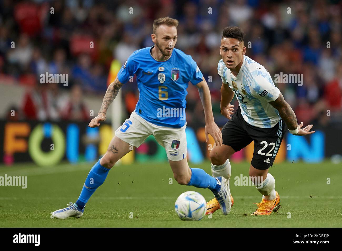 Manuel Lazzari (SS Lazio) of Italy and Lautaro Martinez (Inter Milan) of Argentina compete for ...