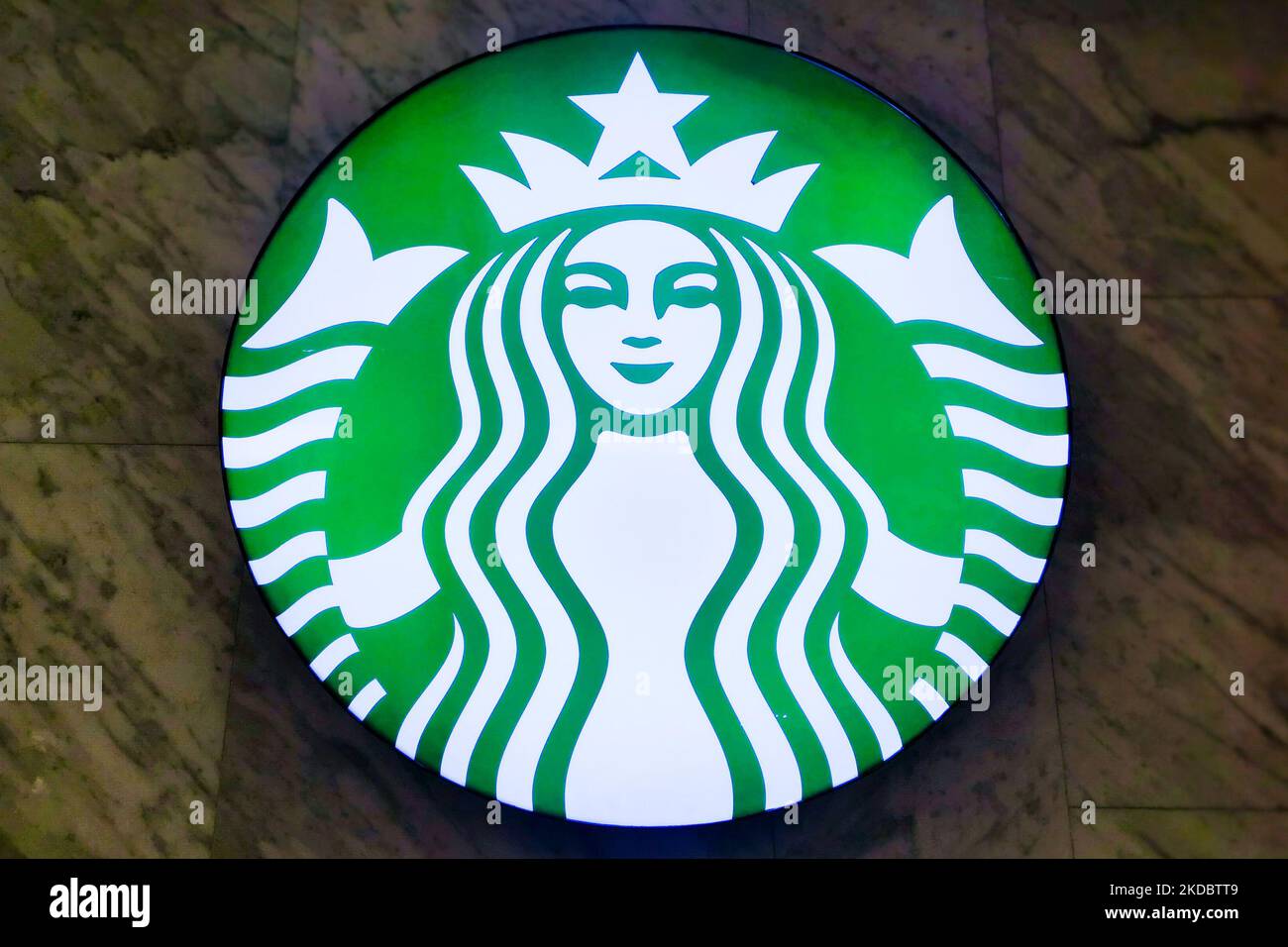 Starbucks logo is seen on a coffee shop at the railway station in ...