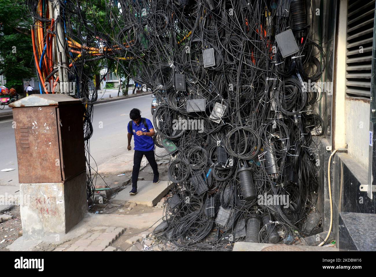 People walk through the scattered internet and satellite connection ...