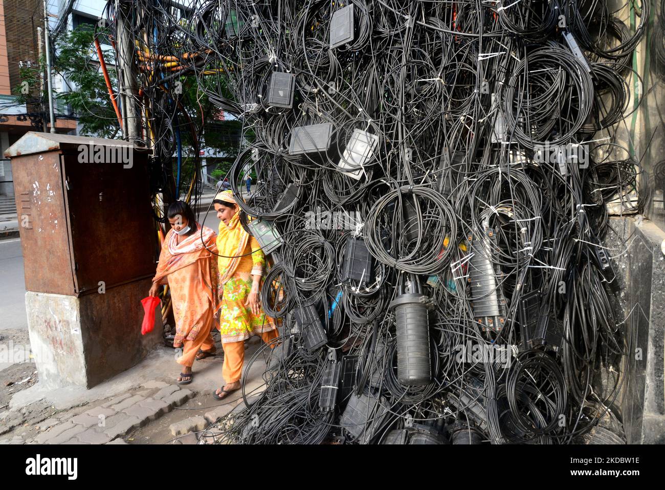 People walk through the scattered internet and satellite connection ...
