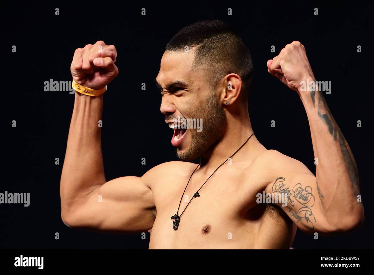 Josh Culibao of Australia reacts on the scale during the UFC 275 Weigh ...