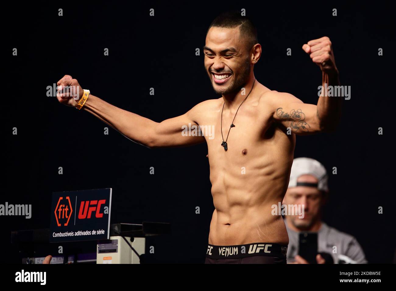 Josh Culibao of Australia reacts on the scale during the UFC 275 Weigh ...
