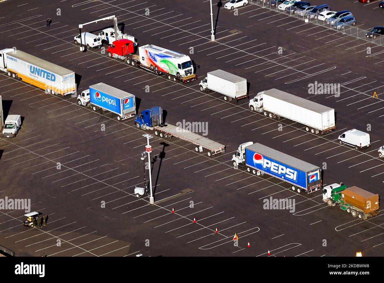 Trucks line up on a parking lot to be x-rayed by a U.S. Customs and ...