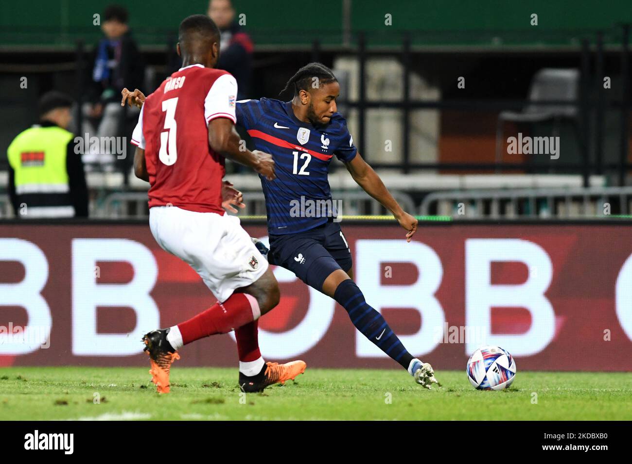 Christopher Nkunku in action against Kevin Danso during Austria vs ...