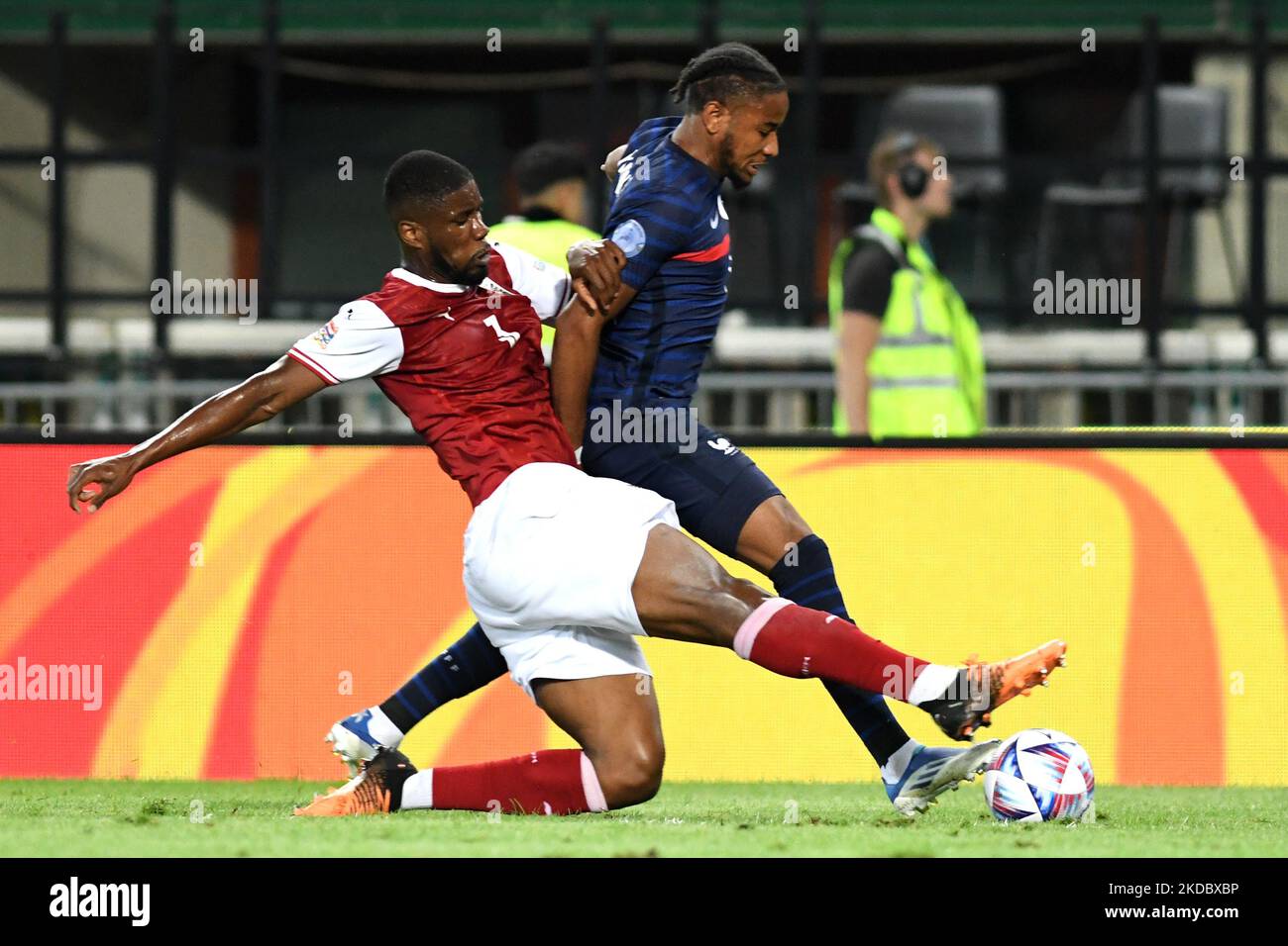 Christopher Nkunku in action against Kevin Danso during Austria vs ...