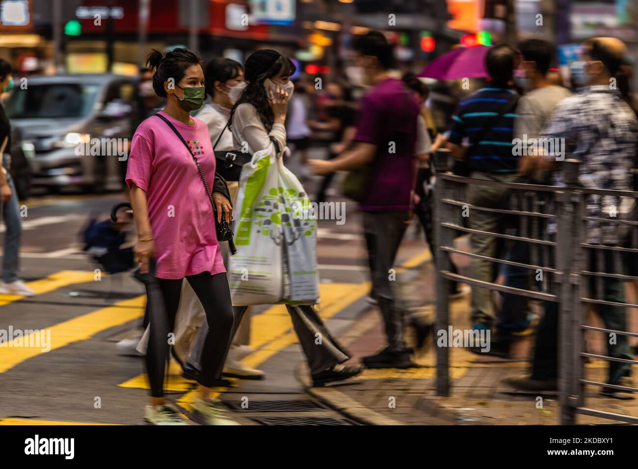 Hong Kong, China, 11 Jun 2022, People cross a street in Mongkok in this ...