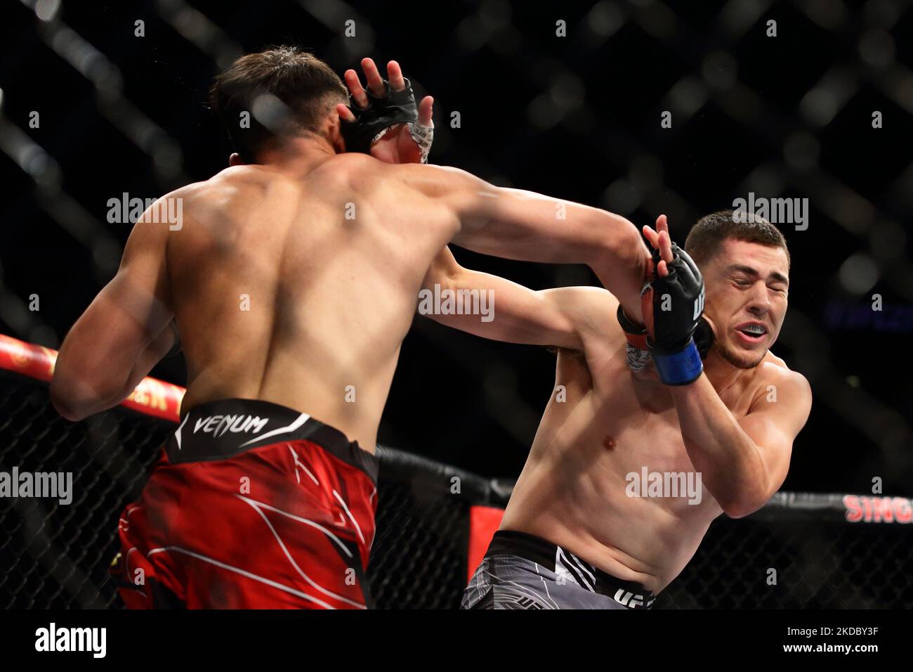 Maheshate of China (L) punches Steve Garcia of United States in the men ...
