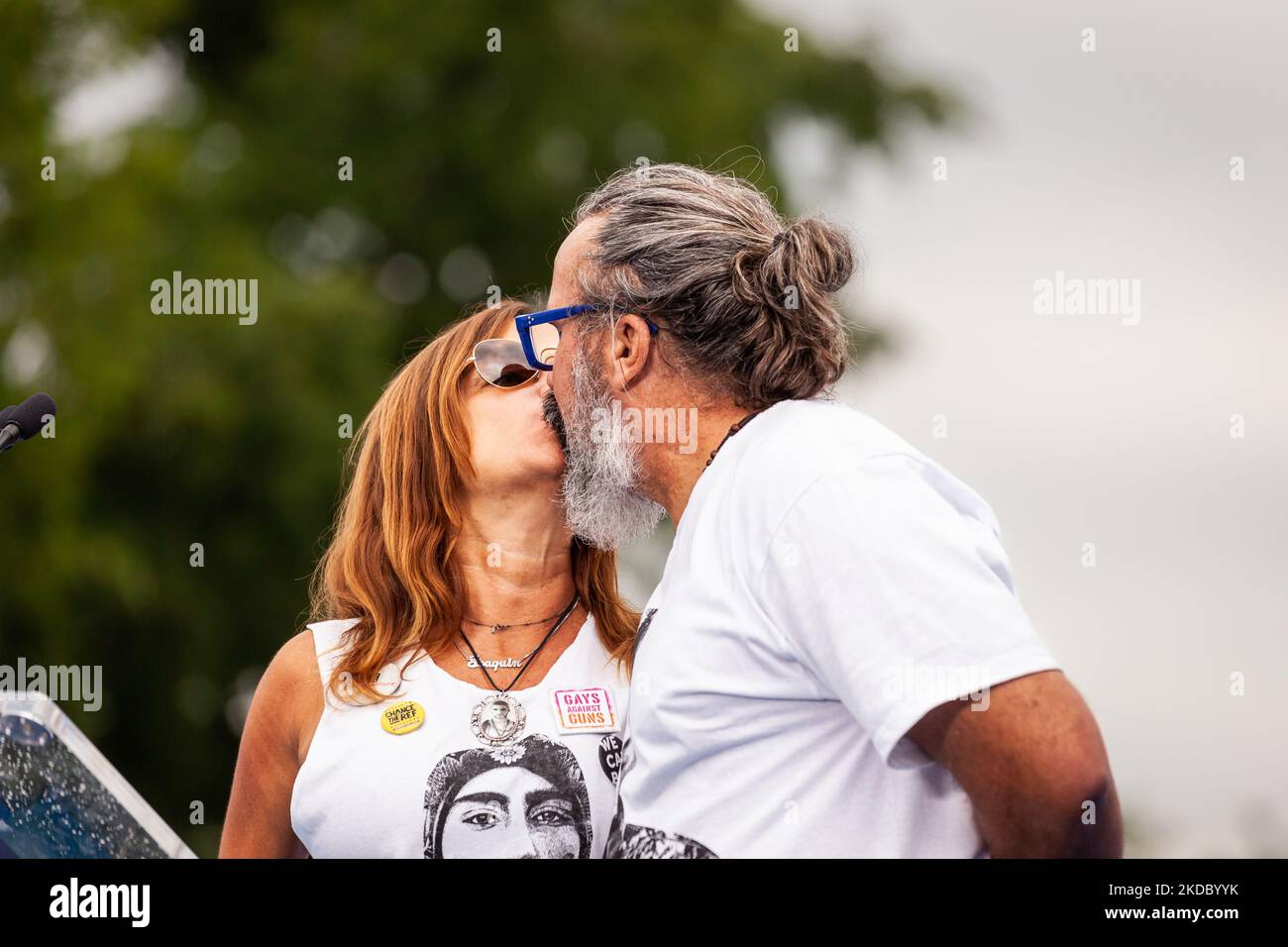 Patricia Oliver gets a kiss after introducing her "adorable husband" at ...