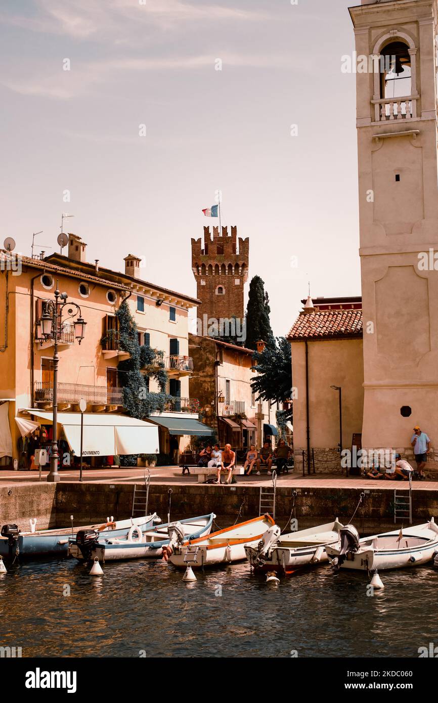 a vertical shot of Little Italian harbour in rhe town of Lazise lake ...