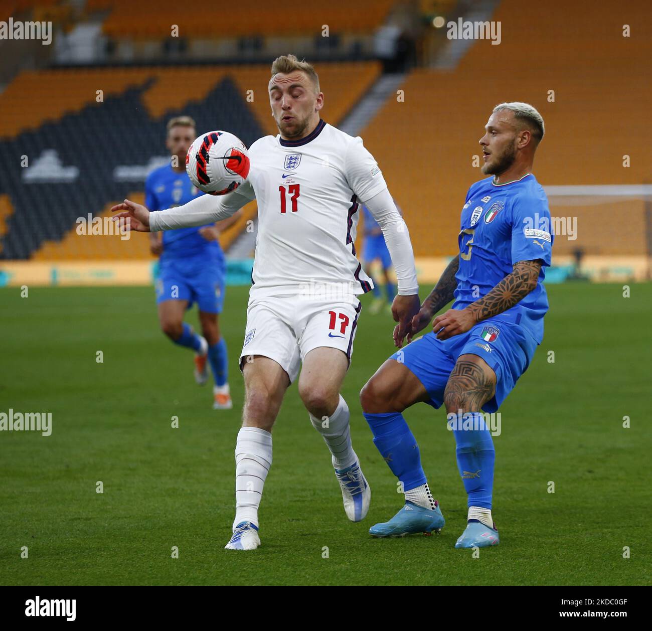 Federico Dimarco of Italy holds of Jarrod Bowen (West Ham) of England ...