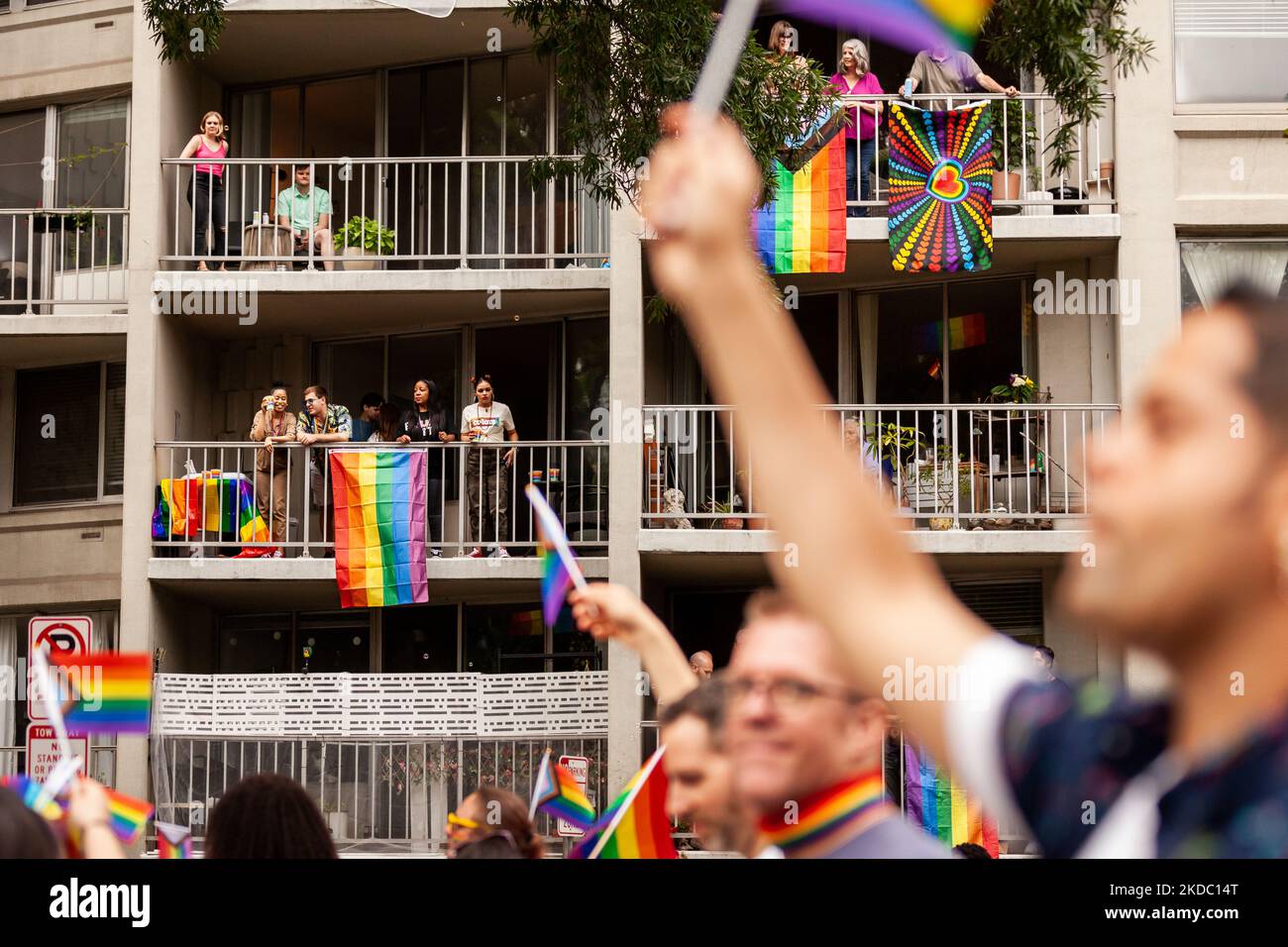 People watch Washington, DC’s annual Pride Parade from their balconies ...
