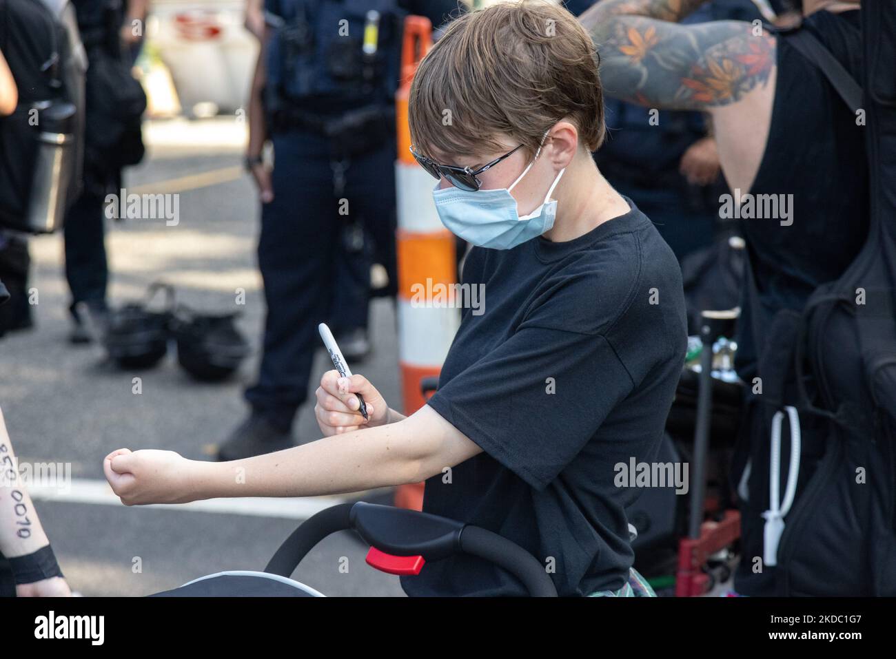 Demonstrators arm in arm block hi-res stock photography and images - Alamy