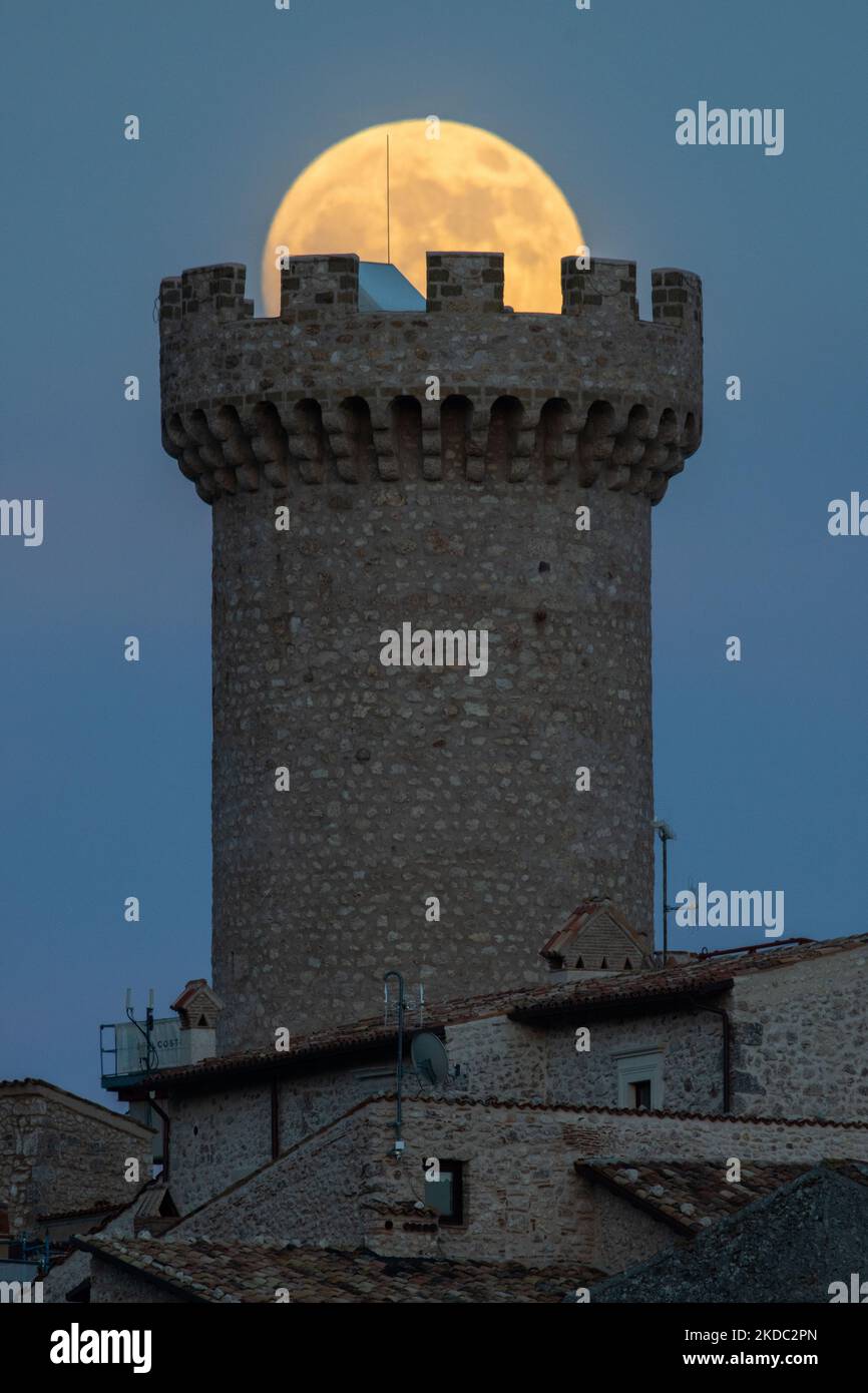 Full strawberry super moon rises behind medieval tower of Santo Stefano ...