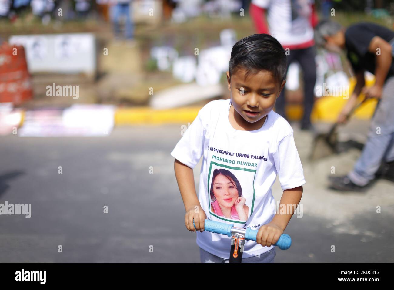 A child, relative of missing people plays in the Glorieta del Ahuehuete ...