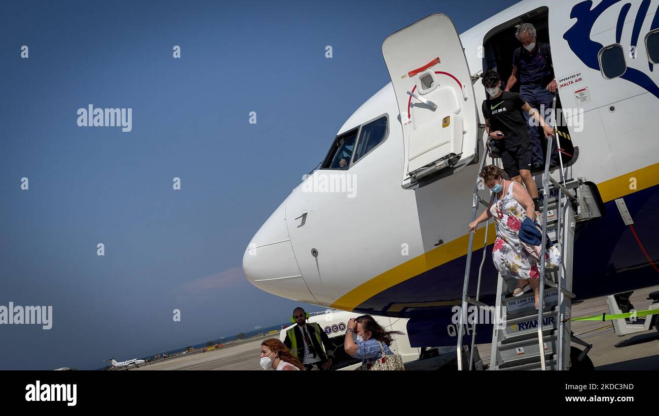 People deplane from a a Ryanair Boeing 737-800 landed in Brindisi ...
