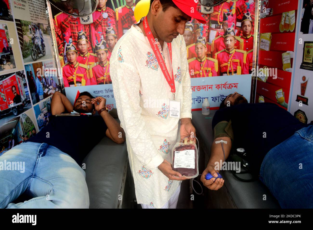 People donate blood at a blood donation camp on the occasion of World ...