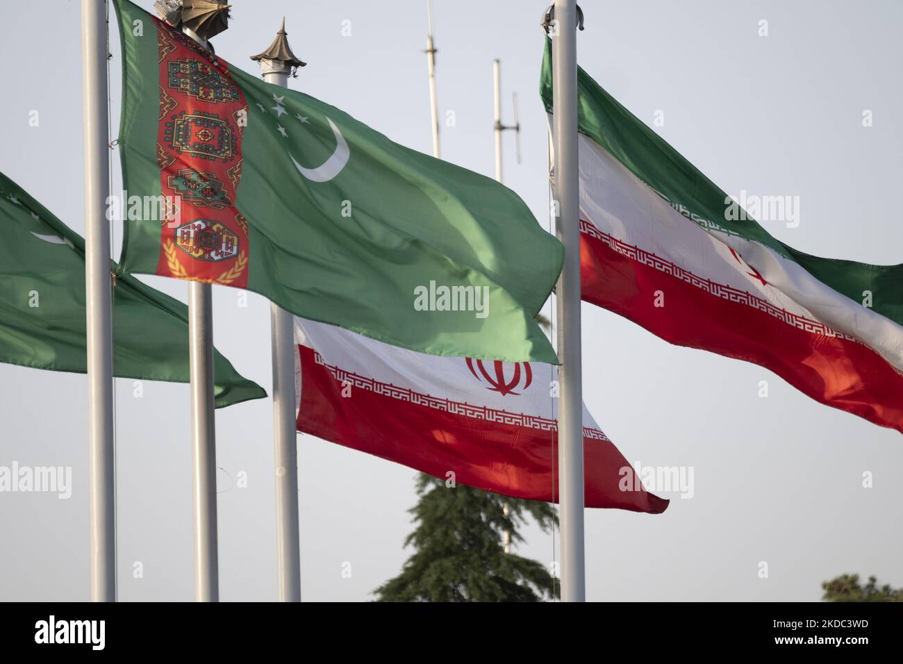 Turkmenistan's flags and Iranian flags are wave next to each other ...