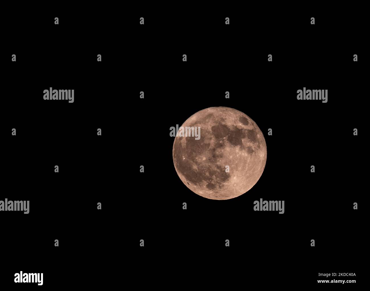 The giant strawberry moon rises in the sky of Atmeh in the countryside ...