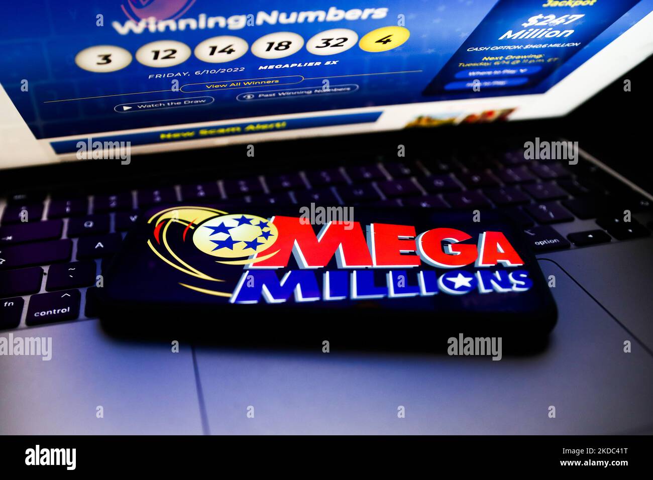 Mega Millions logo displayed on a phone screen and Mega Millions ...