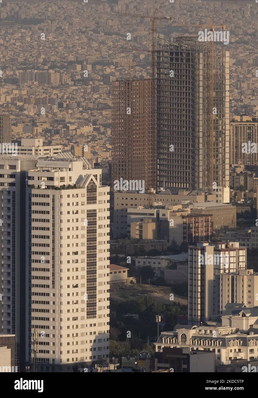 High-rise towers that one of them is currently under construction are ...