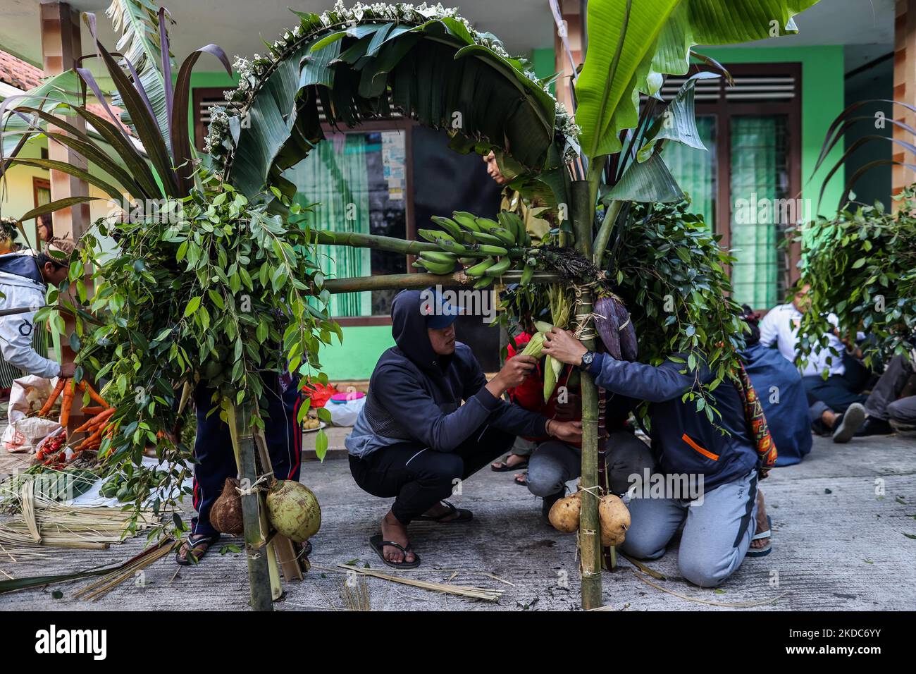 Tenggerese people making offerings of rice, fruits, vegetables, and ...